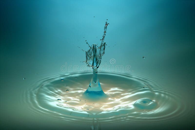 A Drop Falls into the Water, Forming a Column with a Figure Stock Photo ...