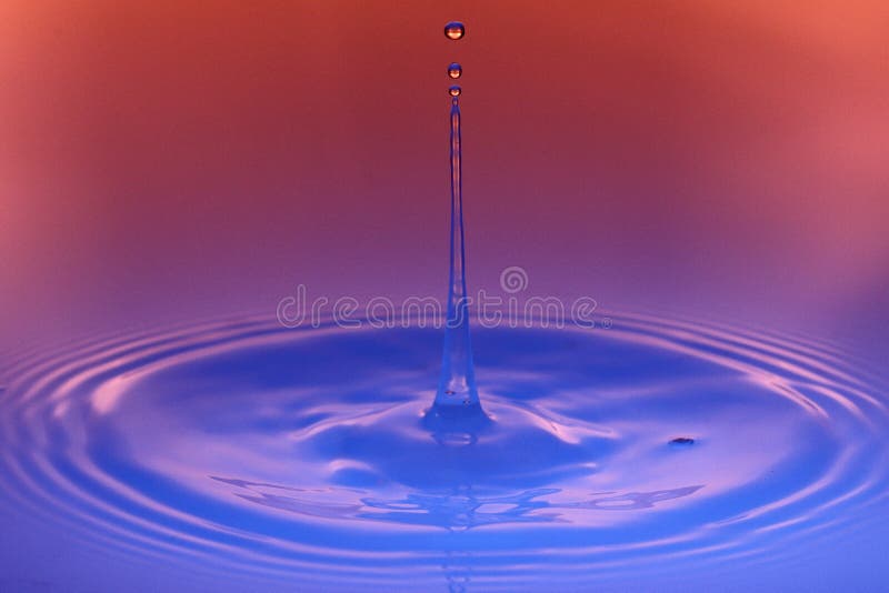 A Drop Falls into the Water, Forming a Column with a Row of Pearls ...