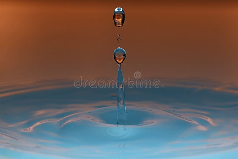 A Drop Falls into the Water, Forming a Column with a Row of Pearls ...