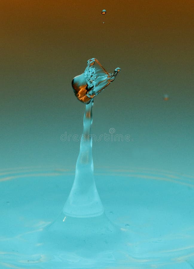 A Drop Falls into the Water, Forming a Column with a Sailing Figure ...