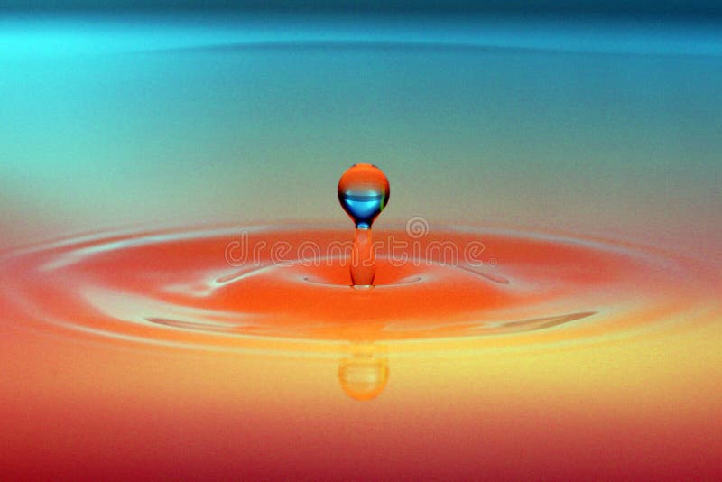 A Drop Falls into the Water, Forming a Floating Ball and Concentric ...