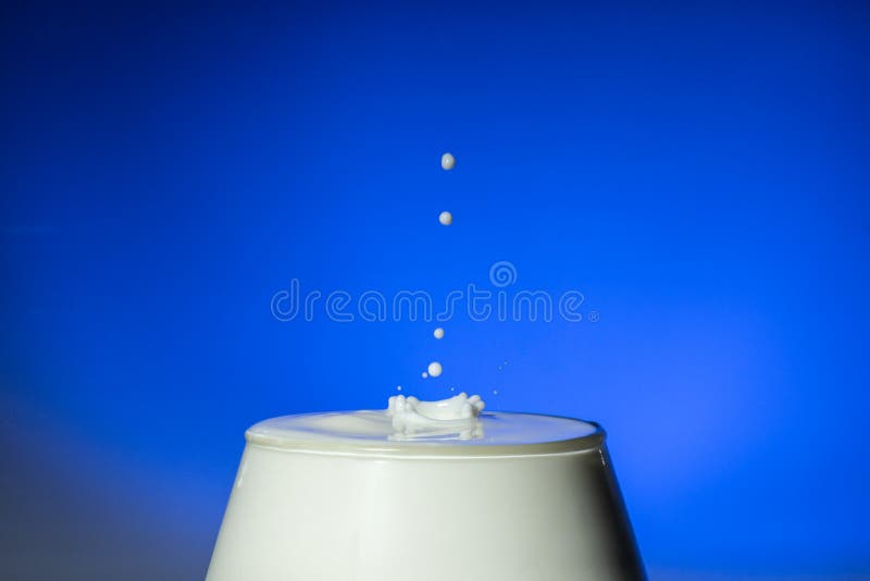 Milk drop splash falling stock photo. Image of cold - 206881978