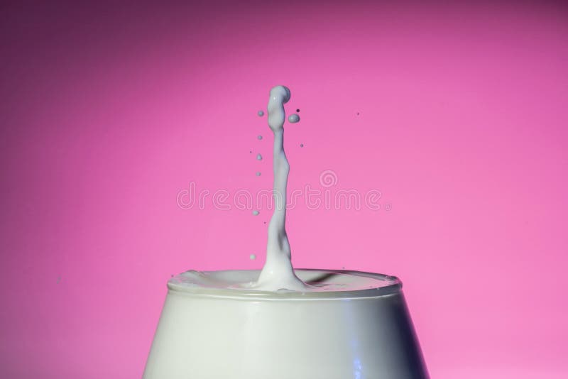 Milk drop splash falling stock photo. Image of flowing - 216647440