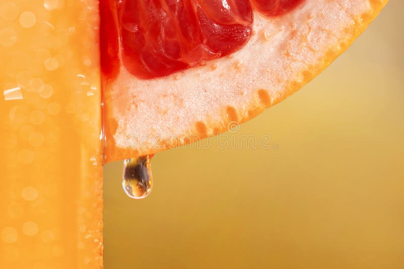 Drop of Juice Drips Down the Grapefruit Slice Along the Misted Glass ...
