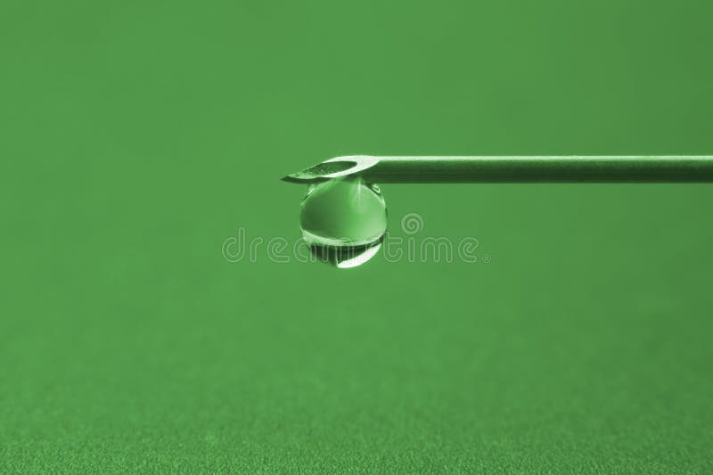 Drop of Liquid Hangs on the Tip of a Medical Injection Needle Stock ...