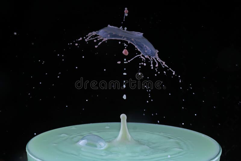 A Drop of Milk Falls into a Cup Stock Photo - Image of shake, white ...
