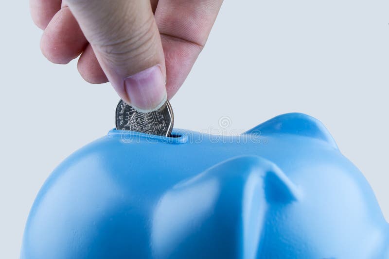 Drop money in piggy bank stock image. Image of finances - 72843721