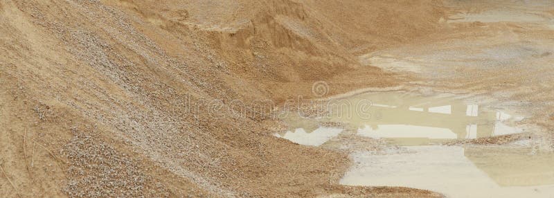 Drop Out Mountains on a Construction Site with Puddles after Rain Stock ...