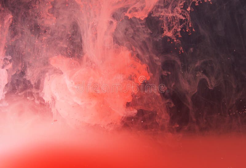 A Drop of Paint Dissolves in Water. Red Paint is Mixed with Water Stock ...