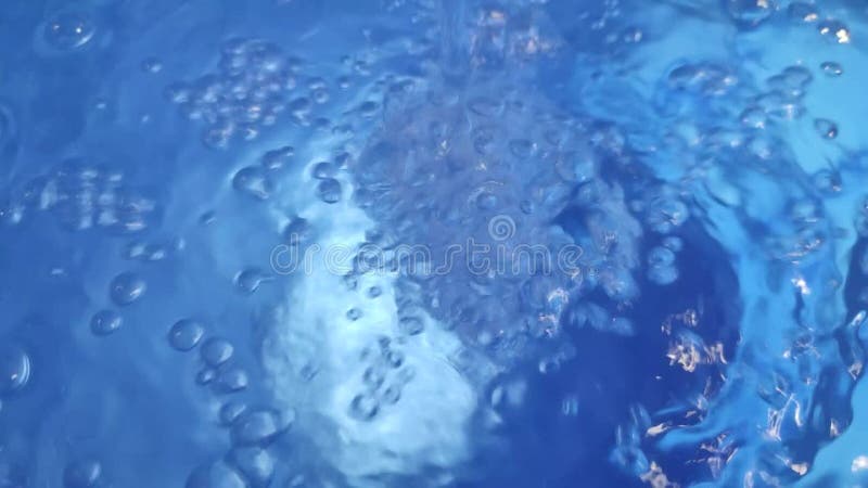 Drop of Pure Blue Water Falls on Smooth Pure Surface, Creating Air ...