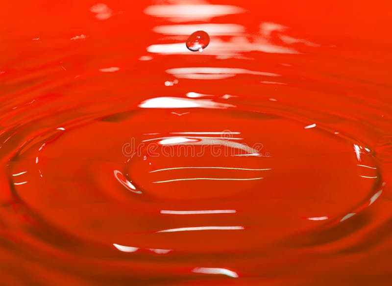 The drop in red water stock image. Image of fall, blue - 8052419