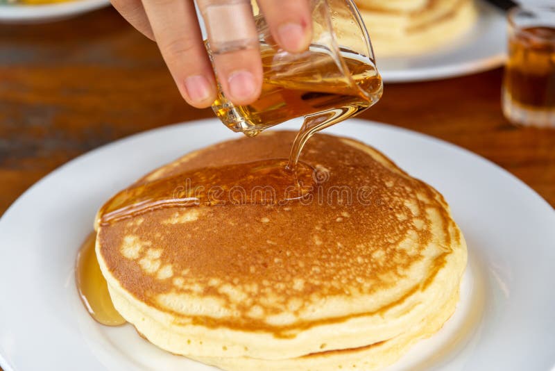 Drop syrup on the pancake stock image. Image of snack - 136840635