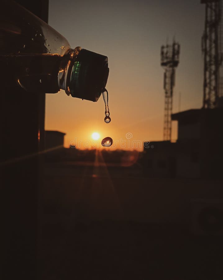 A Drop of Water Beautifying the Sunset. Stock Photo - Image of water ...