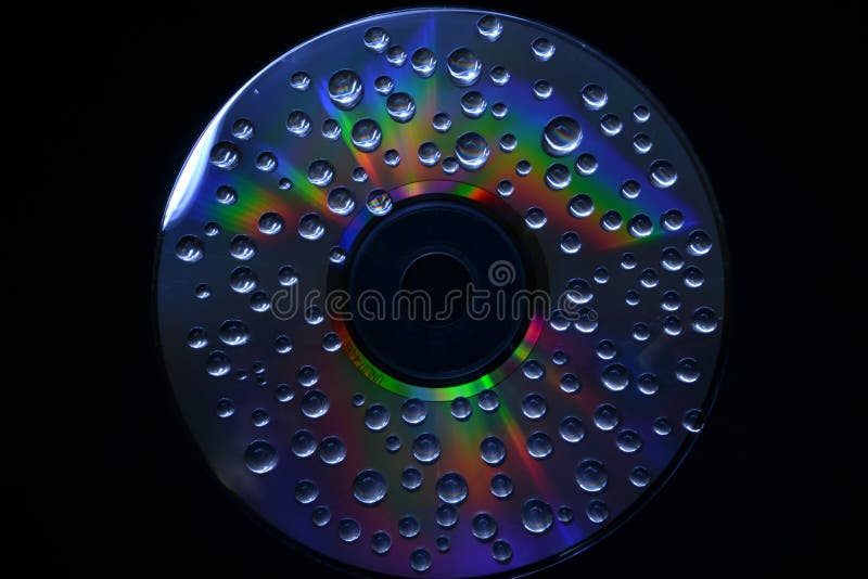 A drop of water on a CD stock photo. Image of drops, light - 45126644