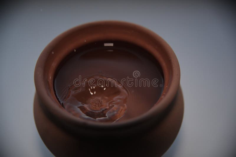 A Drop of Water in a Clay Pot Stock Photo - Image of motion, purity ...