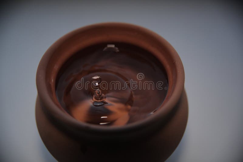 A Drop of Water in a Clay Pot Stock Image - Image of liquid, wave: 94852719