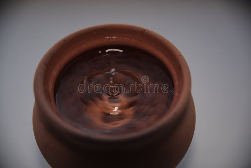 A Drop of Water in a Clay Pot Stock Image - Image of liquid, wave: 94852719