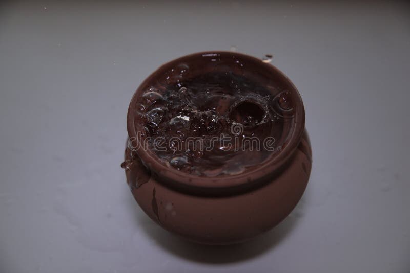A Drop of Water in a Clay Pot Stock Image - Image of surface ...