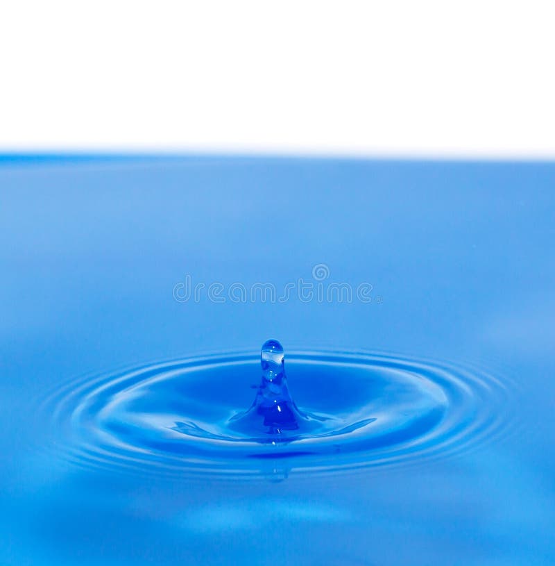 A Drop of Water Falling in Blue Water. Macro Stock Image - Image of ...