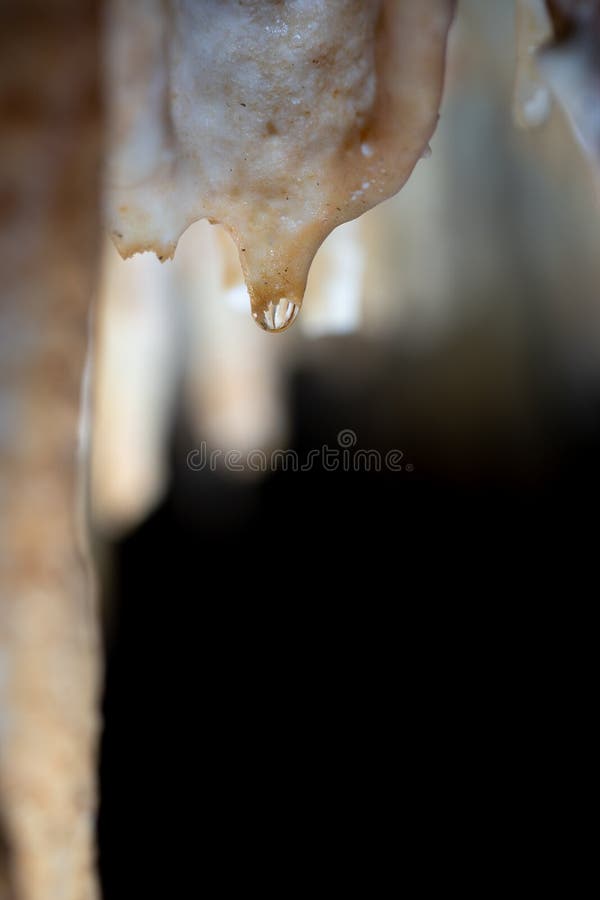 Drop of Water Falling from Stalactite, Closeup View Stock Photo - Image ...