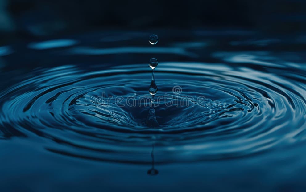 A Drop of Water is Gently Falling into a Still Pool of Water Stock ...