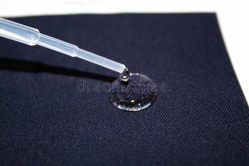 Drop of Water on a Piece of Fabric Stock Image - Image of falling ...