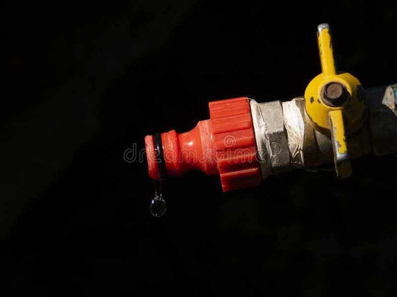 A Drop of Water from a Red Water Tap Stock Photo - Image of people ...