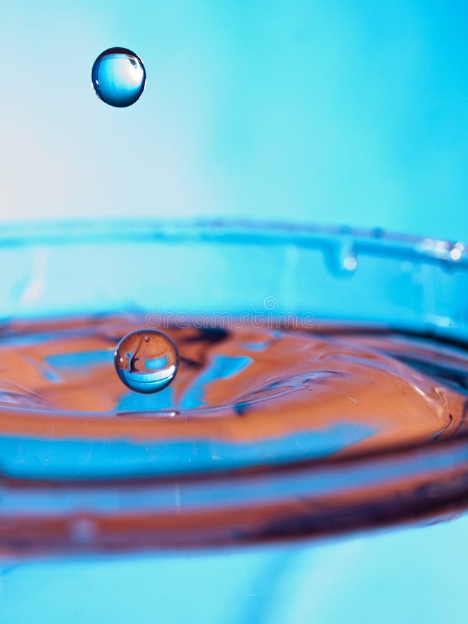 Droplet Falling in the Blue Water Stock Photo - Image of blue ...