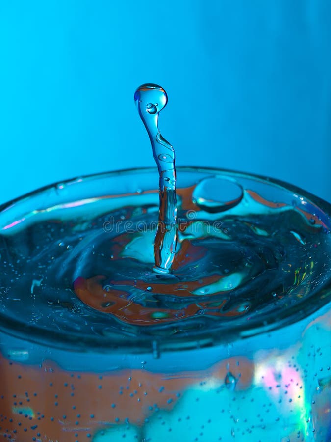Droplet Falling in the Blue Water Stock Photo - Image of blue ...