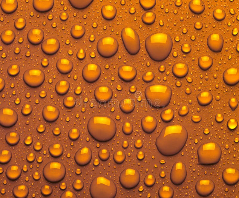 Droplets of amber liquid stock image. Image of rain, liquid - 98752491