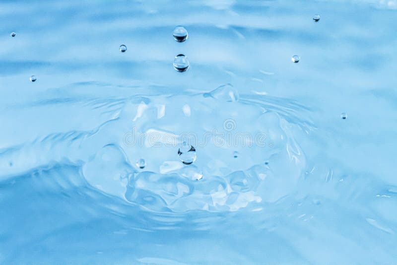 Droplets of Water Fall on the Surface of the Water and Make a Water ...