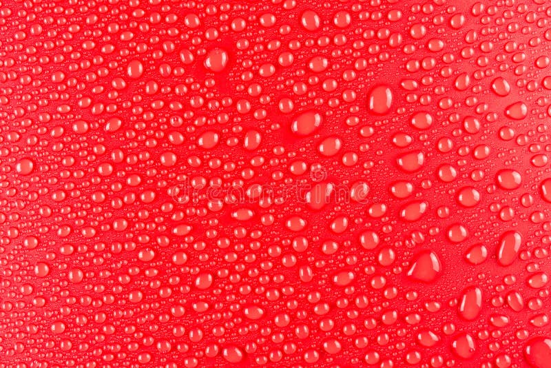 Droplets of Water on a Red, Matte Background Illuminated with a ...