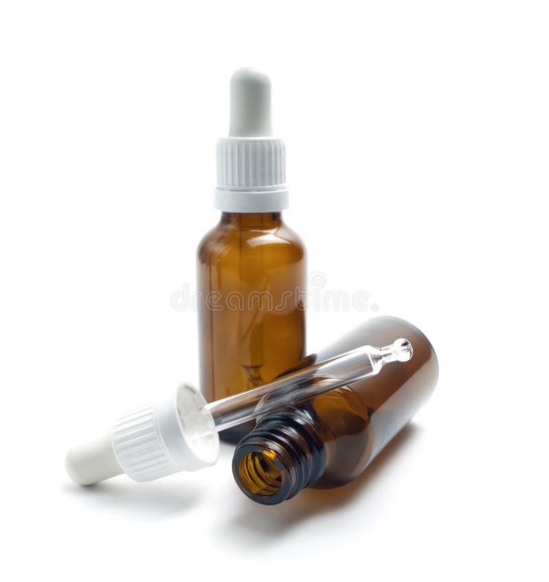 Drop Drops from a Pipette in a Cosmetic Bottle, Isolated on White ...