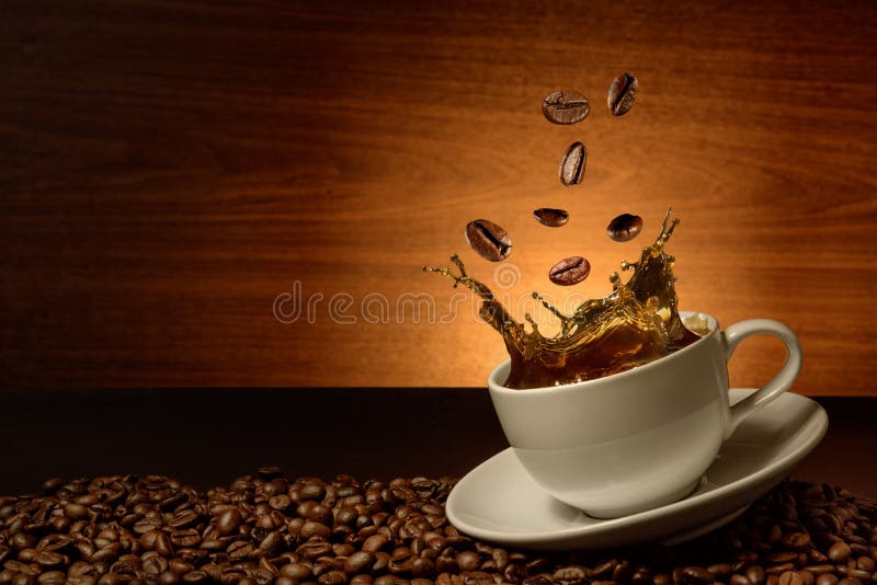 Dropping Coffee Beans on Coffee Cup Stock Photo - Image of beans ...