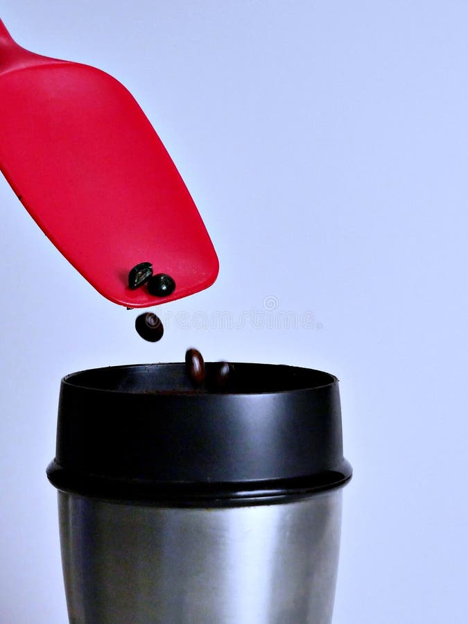 Dropping Coffee Beans in the Grinder Stock Photo - Image of pink ...