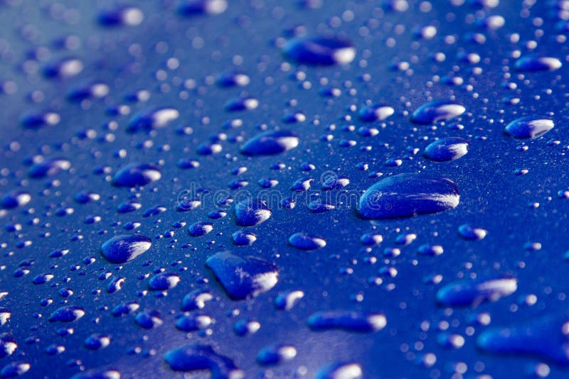 Drops on blue background. stock photo. Image of coat - 40890434