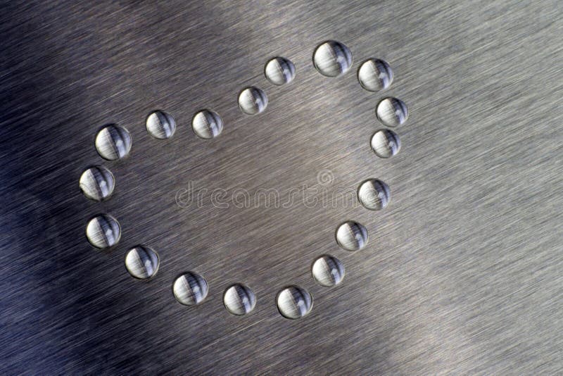 Drops in the Form of Heart. the Surface is Metallic Blue Stock Photo ...