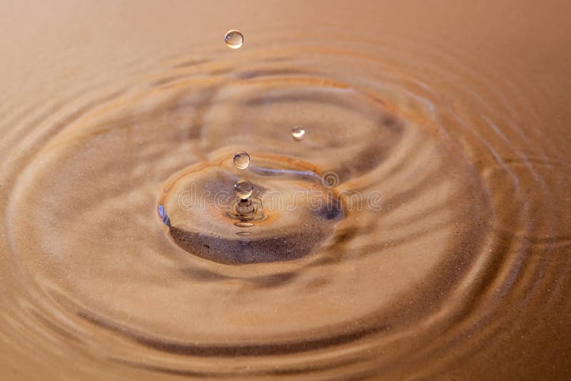The Drops Left Ripples on the Water and a Few Hung in the Air. Sand is ...