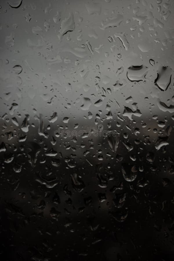 Drops of Rain on a Black Dramatic Window Glass Background. Autunm Rain ...
