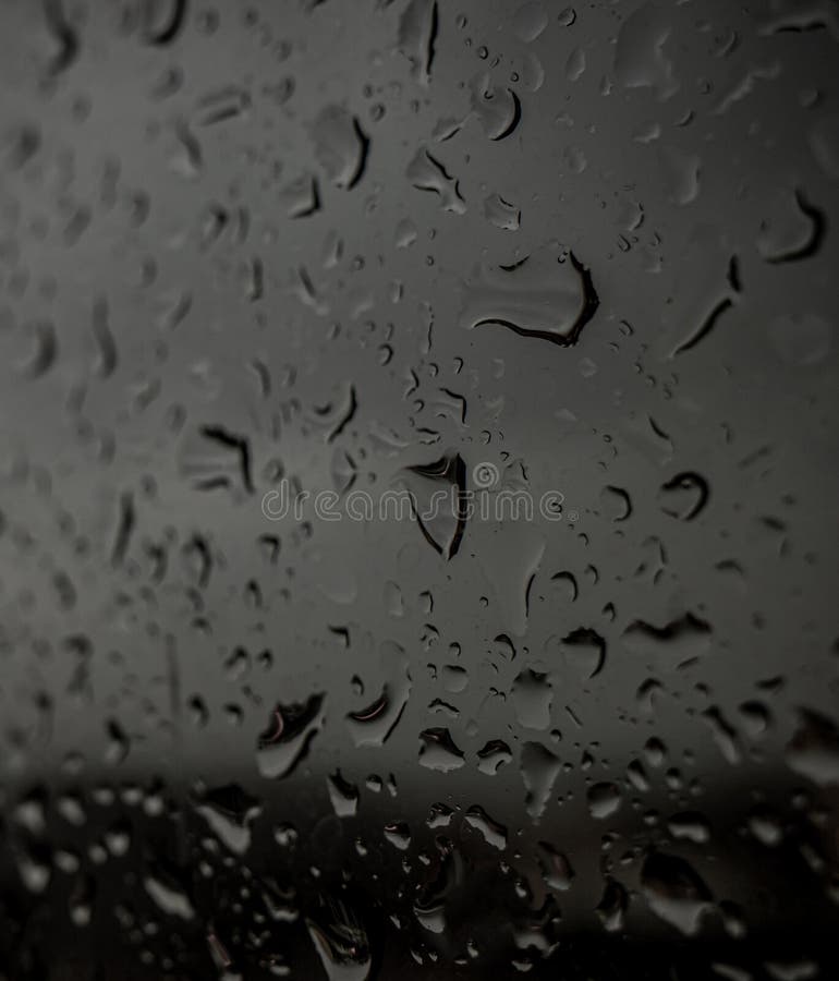 Drops of Rain on a Black Dramatic Window Glass Background. Autunm Rain ...