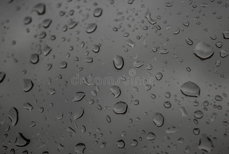 Drops of Rain on a Black Dramatic Window Glass Background. Autunm Rain ...
