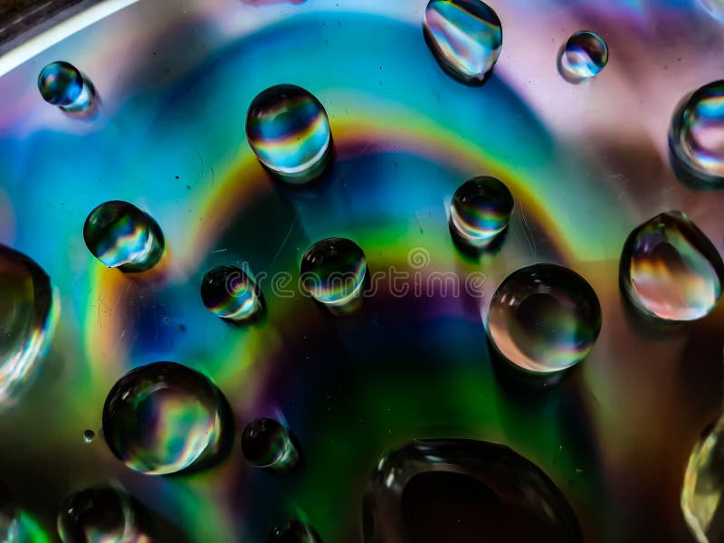 Water is Dropping on the CD Discs and Red, Blue and Yellow Lights are ...