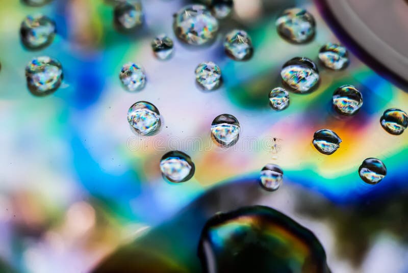 Water is Dropping on the CD Discs and Red, Blue and Yellow Lights are ...