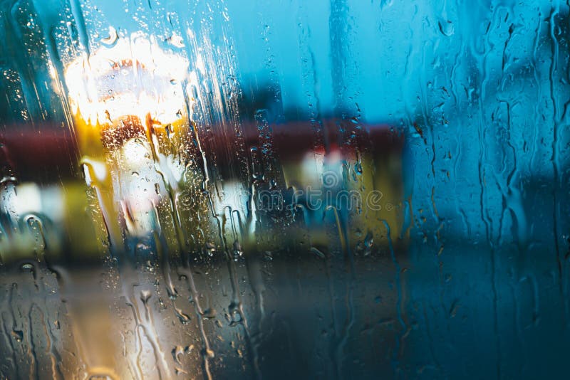 Drops of Rain on Window with Abstract Bokeh Lights Stock Photo - Image ...