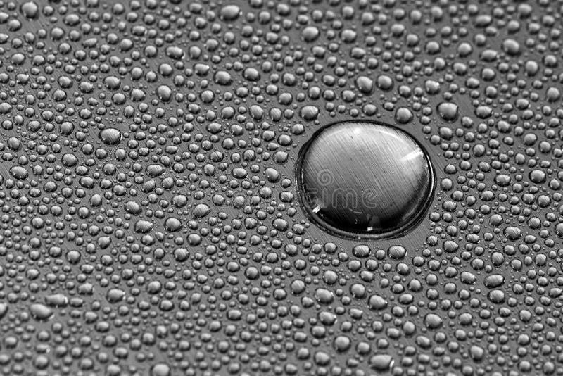 Drops in Row on Metal Surface Stock Photo - Image of droplet, light ...