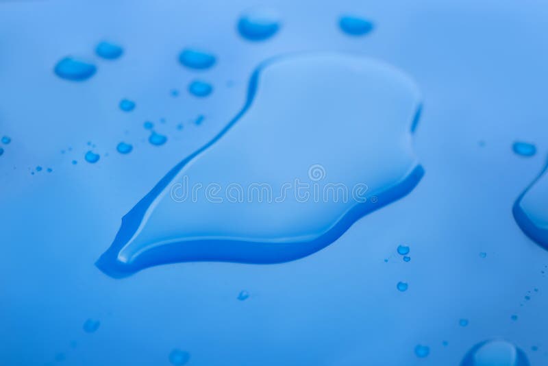 Drops of Spilled Water on Light Blue Background, Closeup Stock Image ...