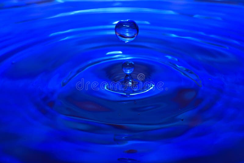 Drops of Water Falling on the Surface of Water. Stock Photo - Image of ...