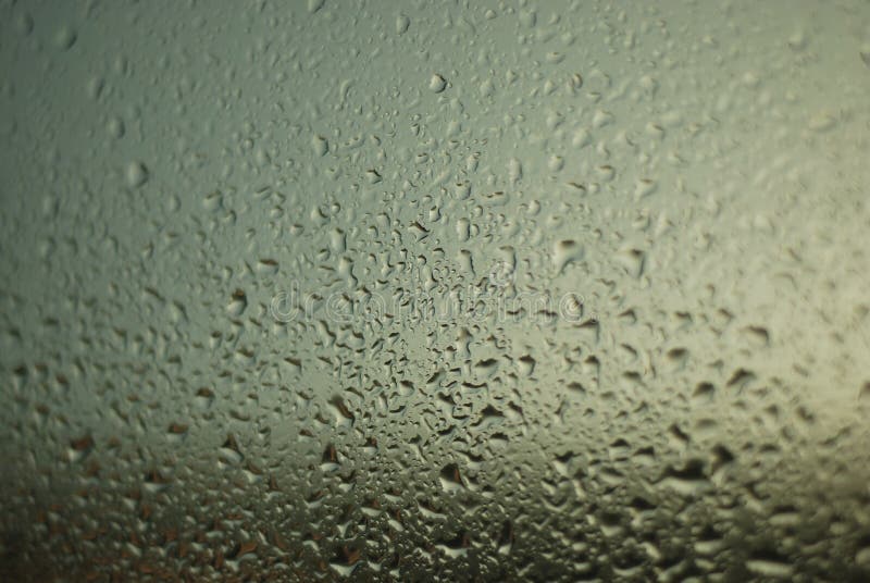 Drops of Water Flow Down the Surface of Transparent Glass. Stock Photo ...
