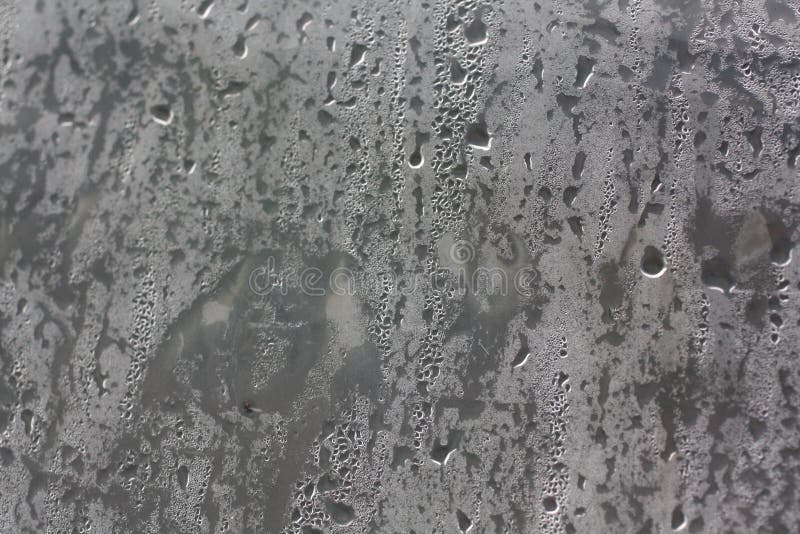 Drops of Water Flow Down a Translucent Surface. Background Texture ...