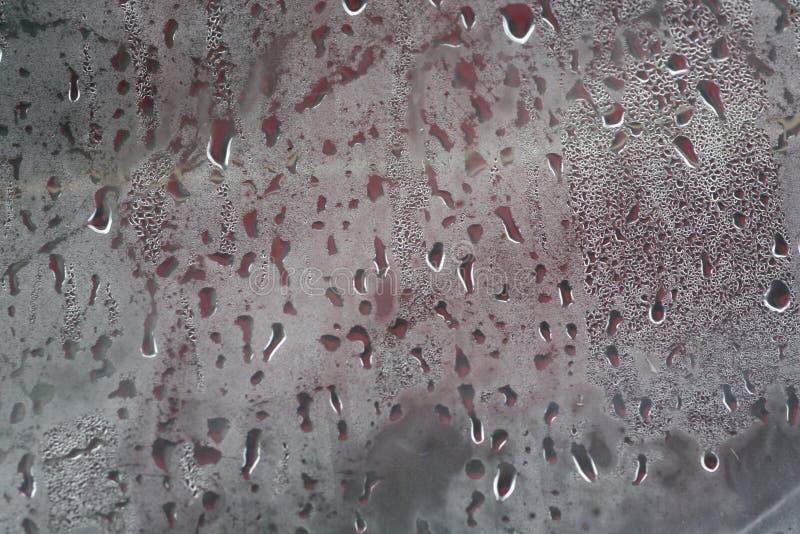 Drops of Water Flow Down a Translucent Surface. Background Texture ...